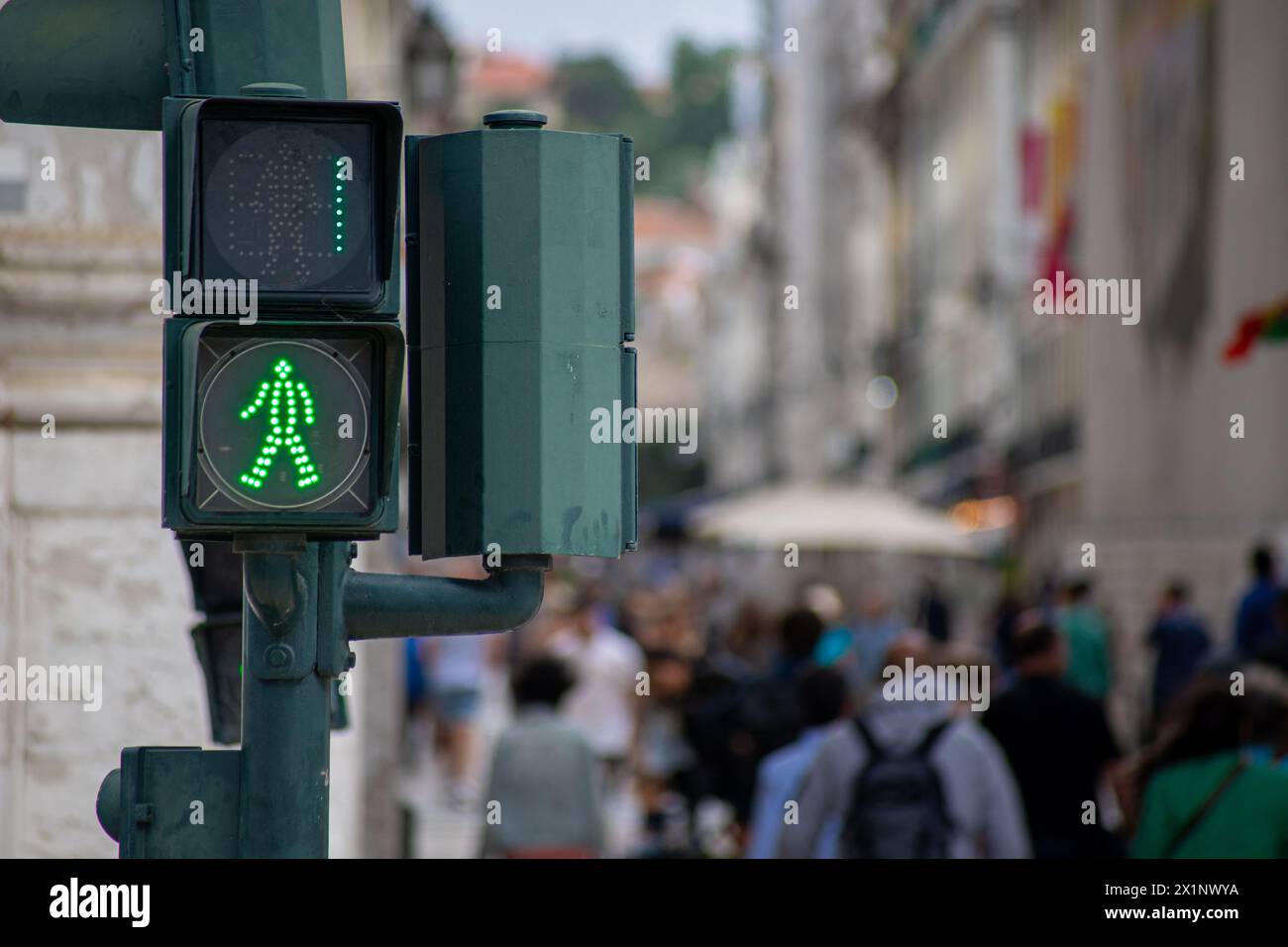 Green traffic light for pedestrians counting down in 1 seconds in ...