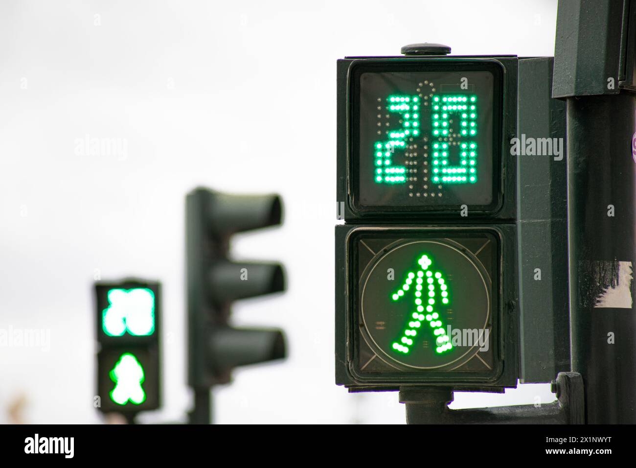 Green traffic light for pedestrians counting down in 20 seconds in ...