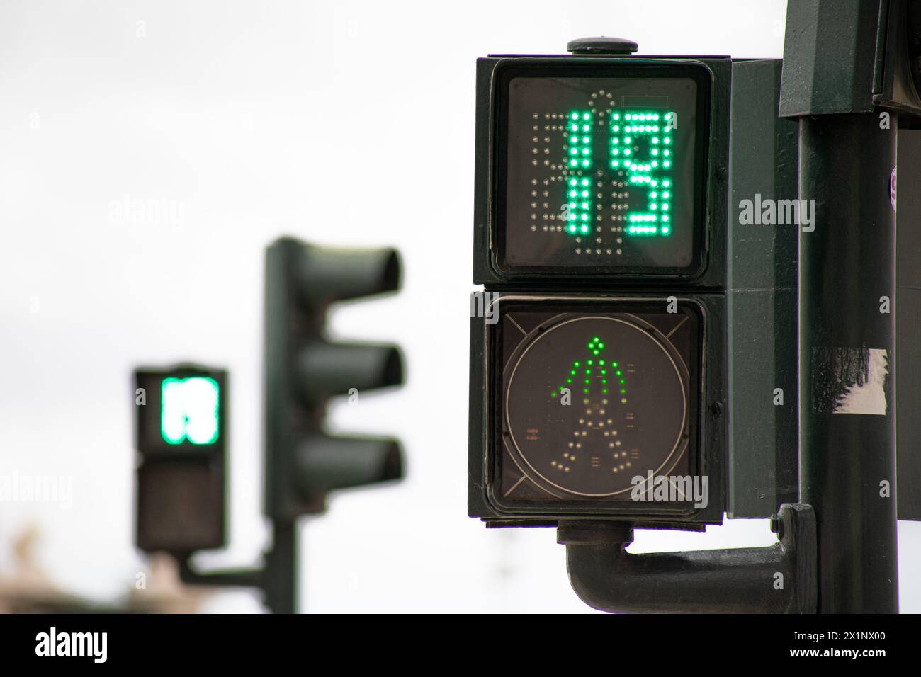Green traffic light for pedestrians counting down in 19 seconds in ...