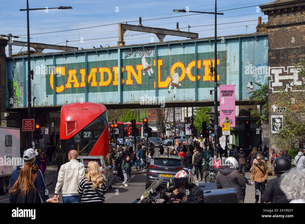 London, UK. 14th April 2024. People walks along Camden High Street past ...
