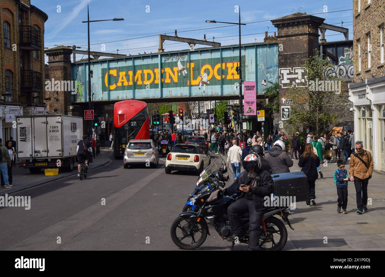 London, UK. 14th April 2024. People walks along Camden High Street past ...