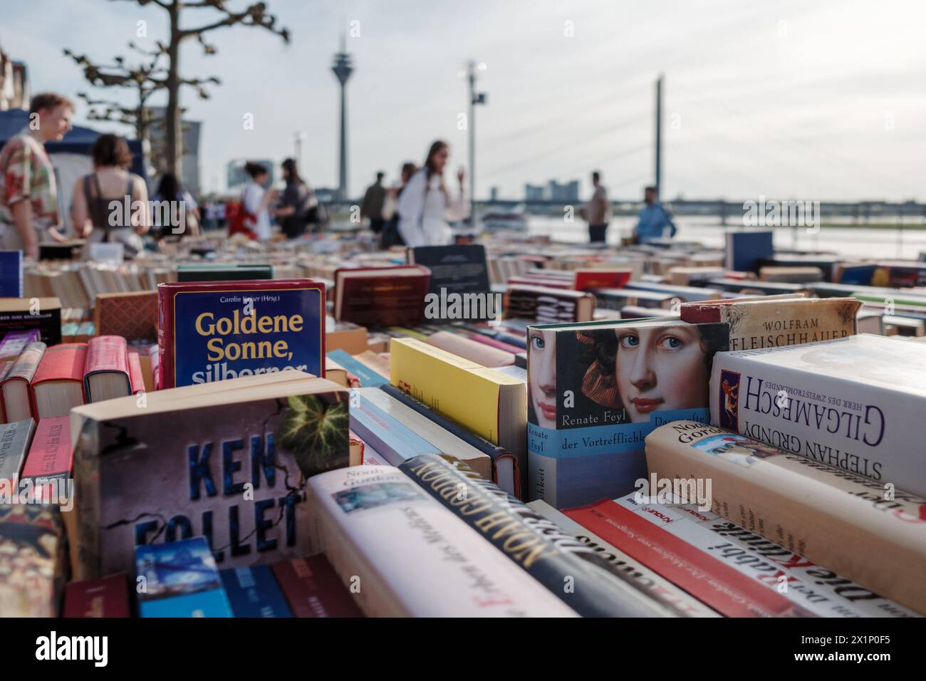 Selected focus on stack of second hand books, outdoor sunny view of ...