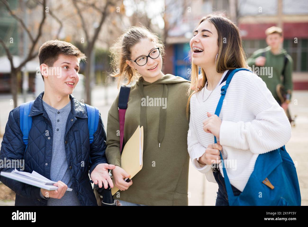 Teenage students talking outside after lessons Stock Photo - Alamy