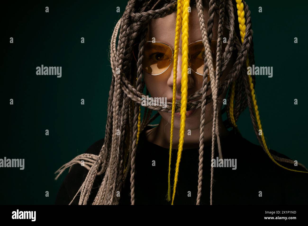 Woman With Yellow Dreadlocks and Black Shirt Stock Photo - Alamy