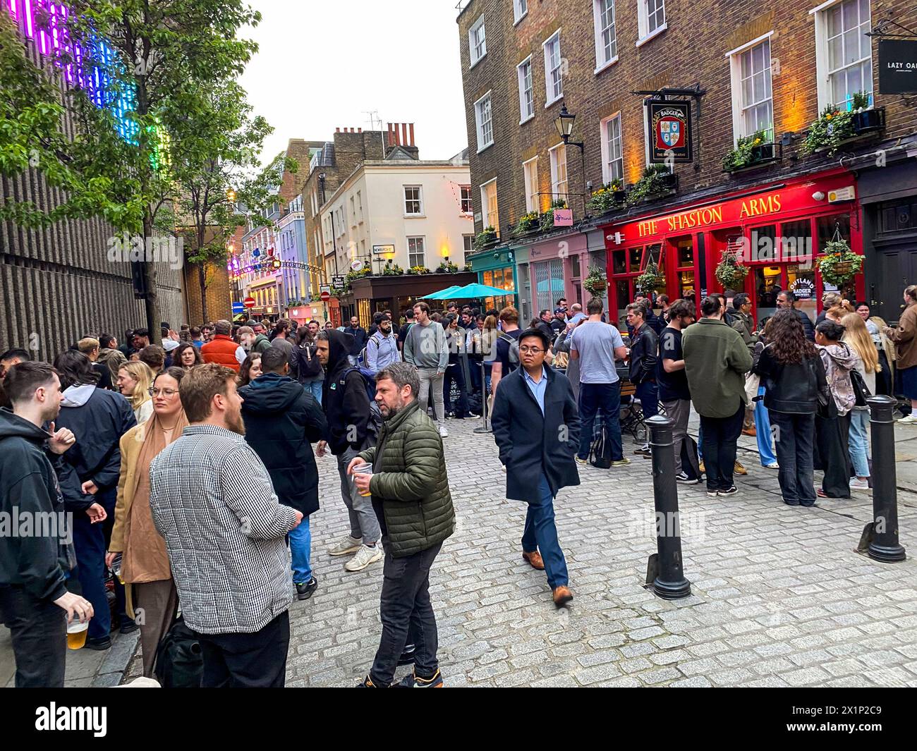 People gather outside pubs in Carnaby Street during a Thursday night in ...