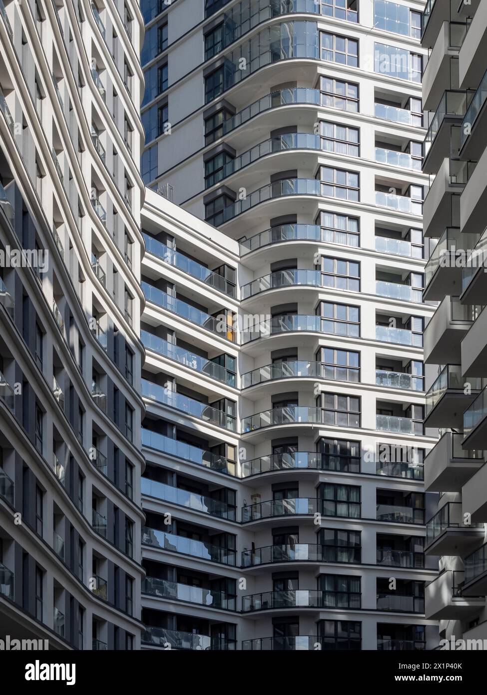 A densely built-up housing estate in the city. White building facades ...