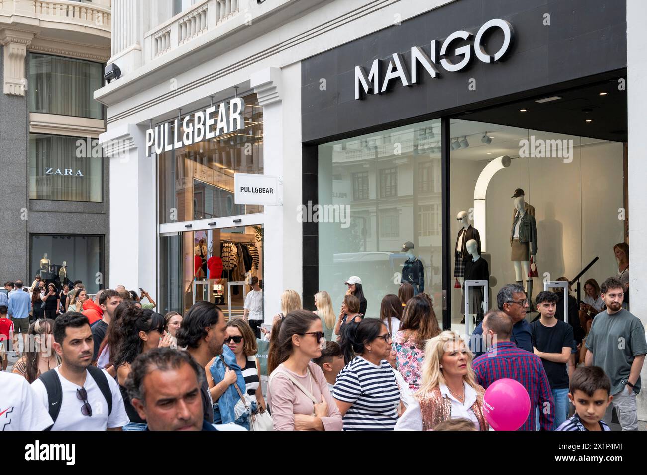 Shoppers and pedestrians walk past the spanish multinational clothing ...