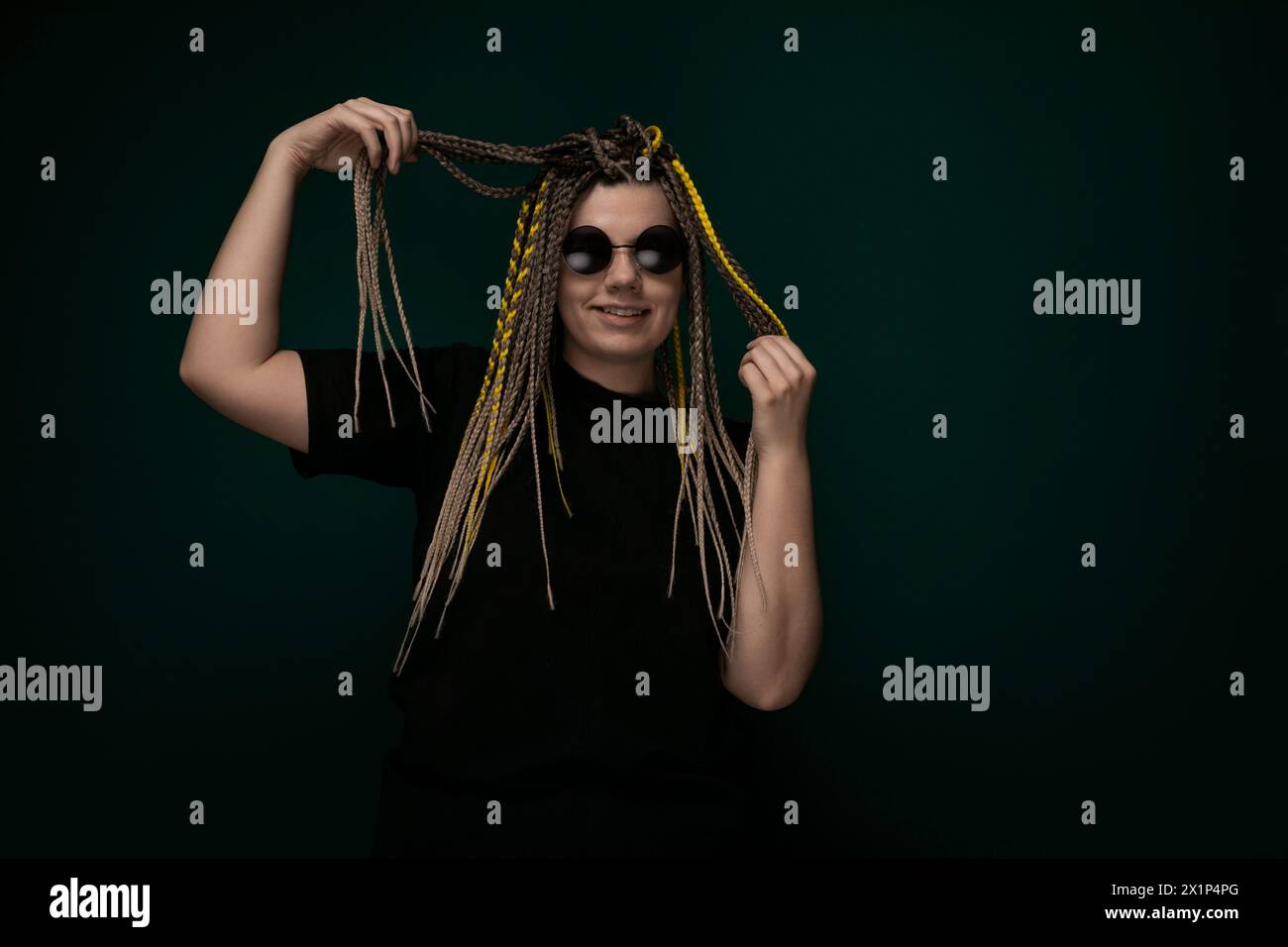 Woman With Dreadlocks Posing for Picture Stock Photo - Alamy
