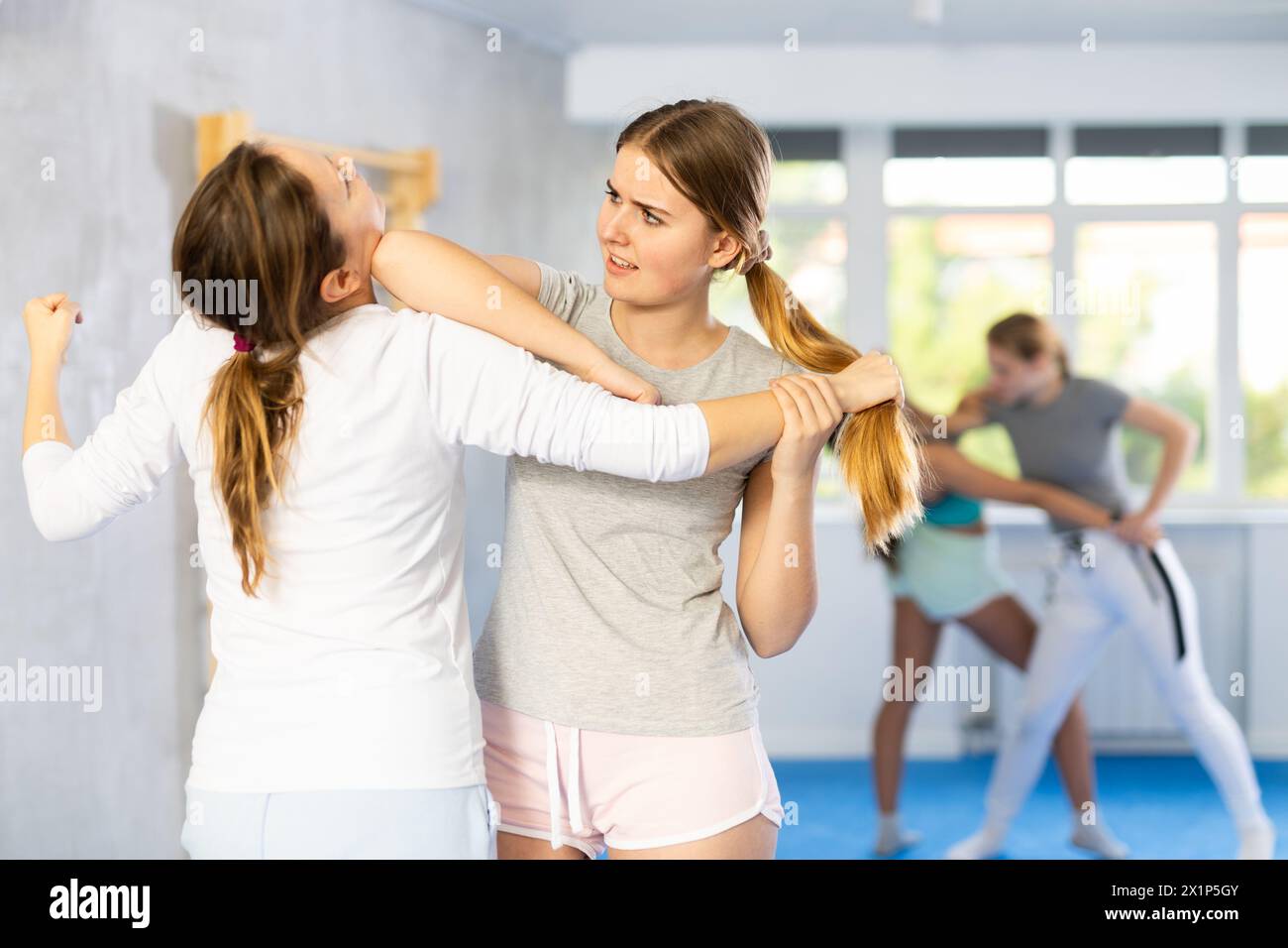 Females practicing self defence moves Stock Photo - Alamy