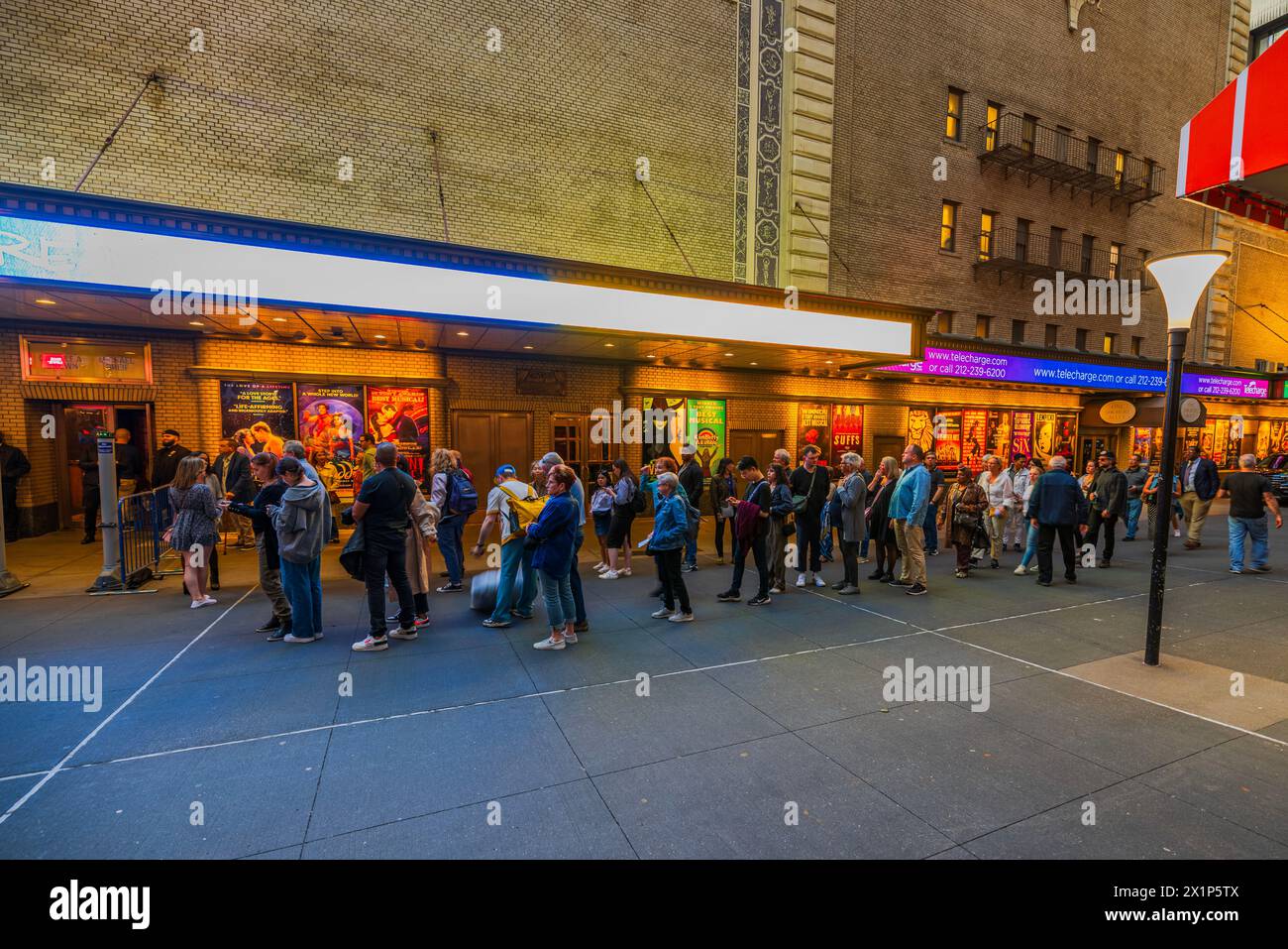 People stand in line for the premiere of "Hell's Kitchen," a new ...