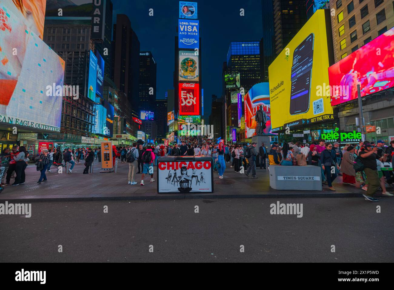 Beautiful night view of Times Square in Manhattan with people strolling ...