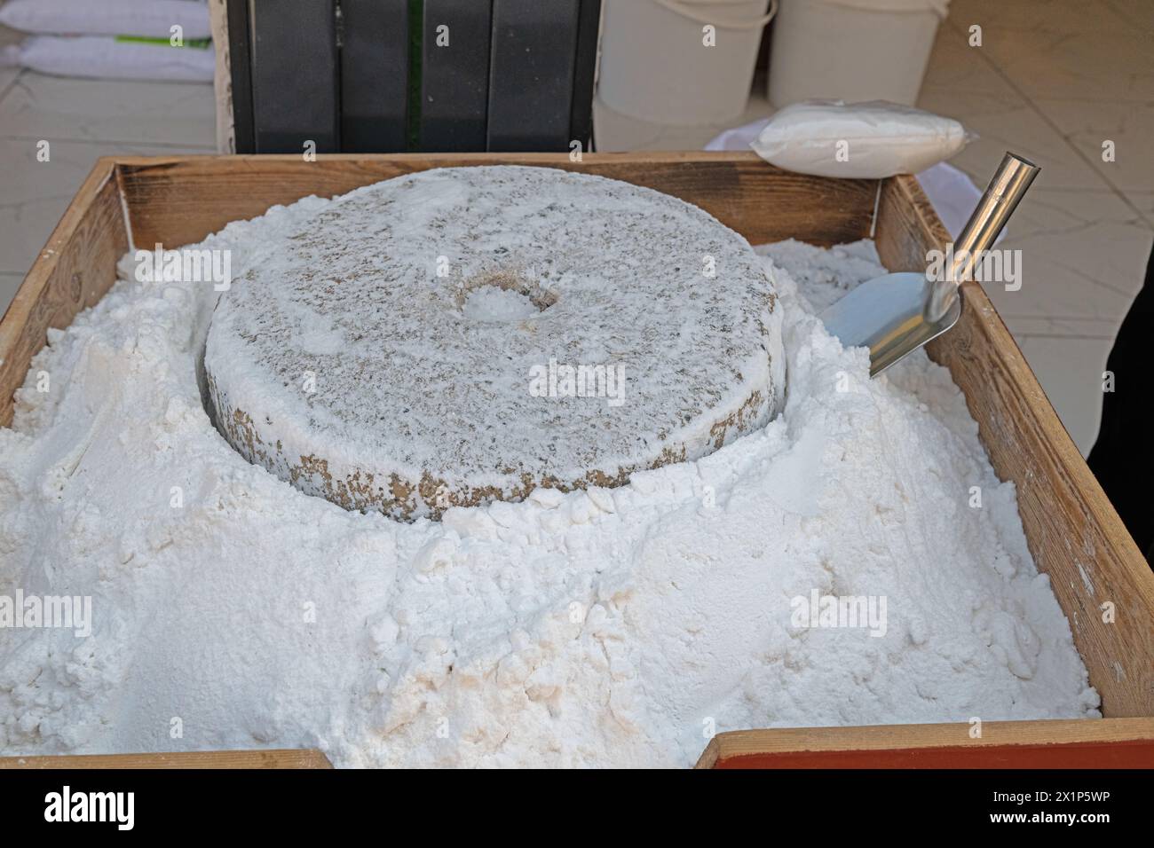 Rock salt ground in a stone mill Stock Photo - Alamy
