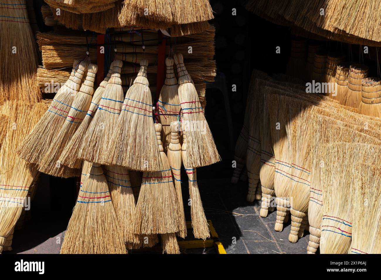 Handmade brooms lined up for sale on the street Stock Photo - Alamy