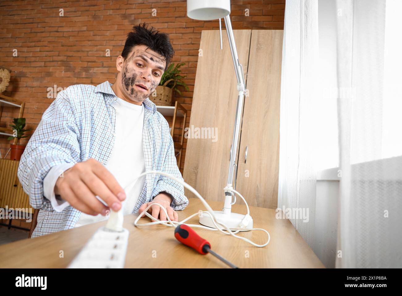 Electrocuted young man with burnt face at home Stock Photo - Alamy