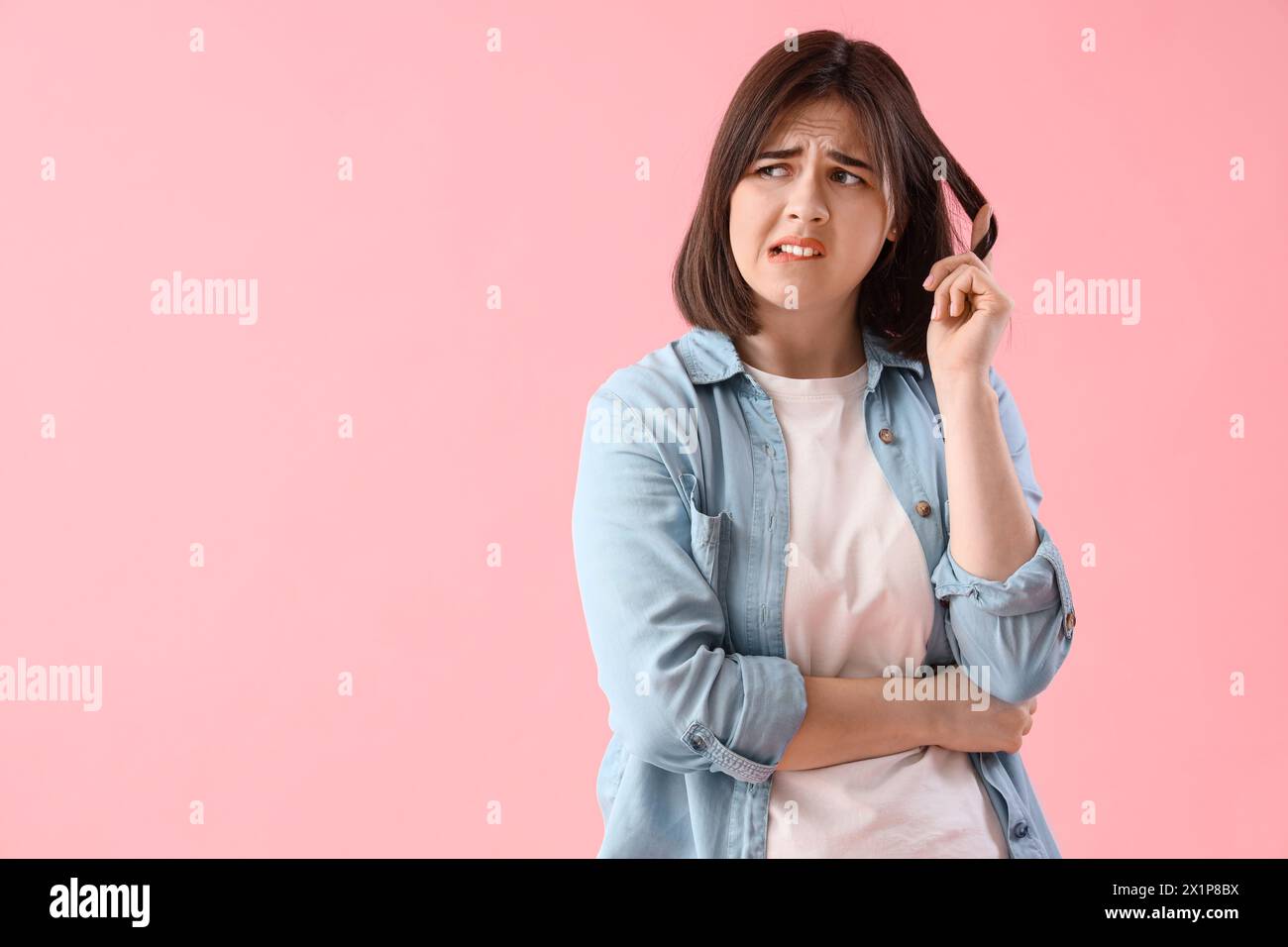Beautiful young stressed woman on pink background. Stress Awareness ...
