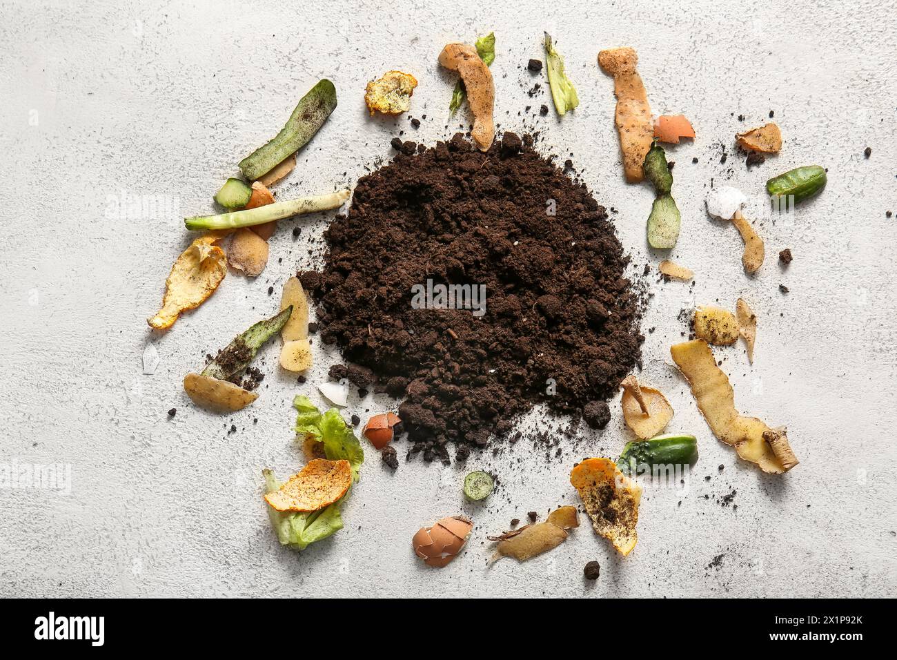 Organic waste and soil on white grunge background. Compost recycling ...