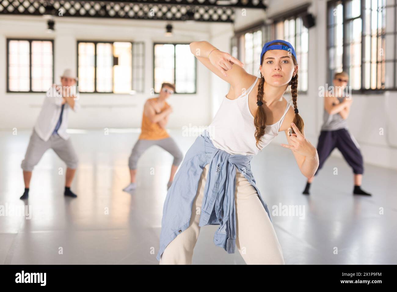 Girl training hip hop at group class Stock Photo - Alamy