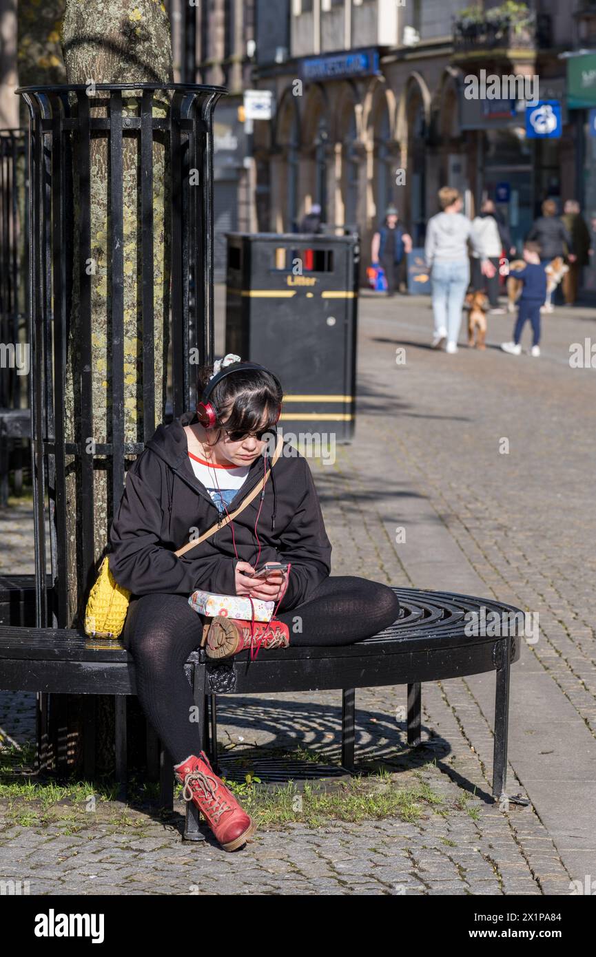 17 April 2024. Elgin,Moray,Scotland. This is a young lady sitting on a ...