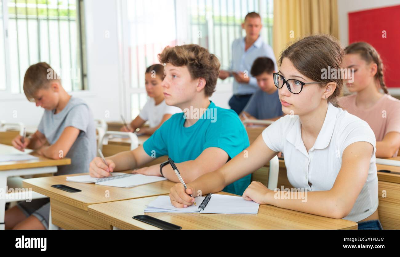 Student is sitting test and answer about task in classroom Stock Photo ...