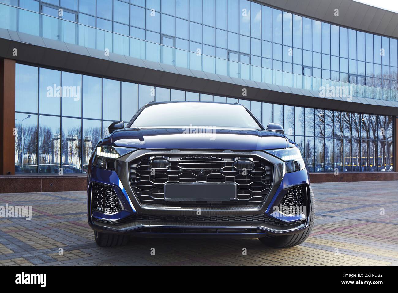 Blue car parked near office building, Modern architecture view with car ...