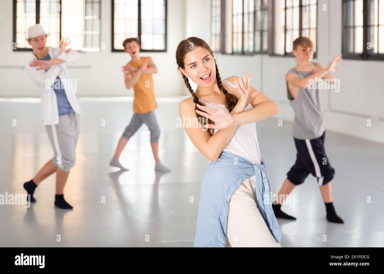Teenage girl practicing active dance at studio Stock Photo - Alamy