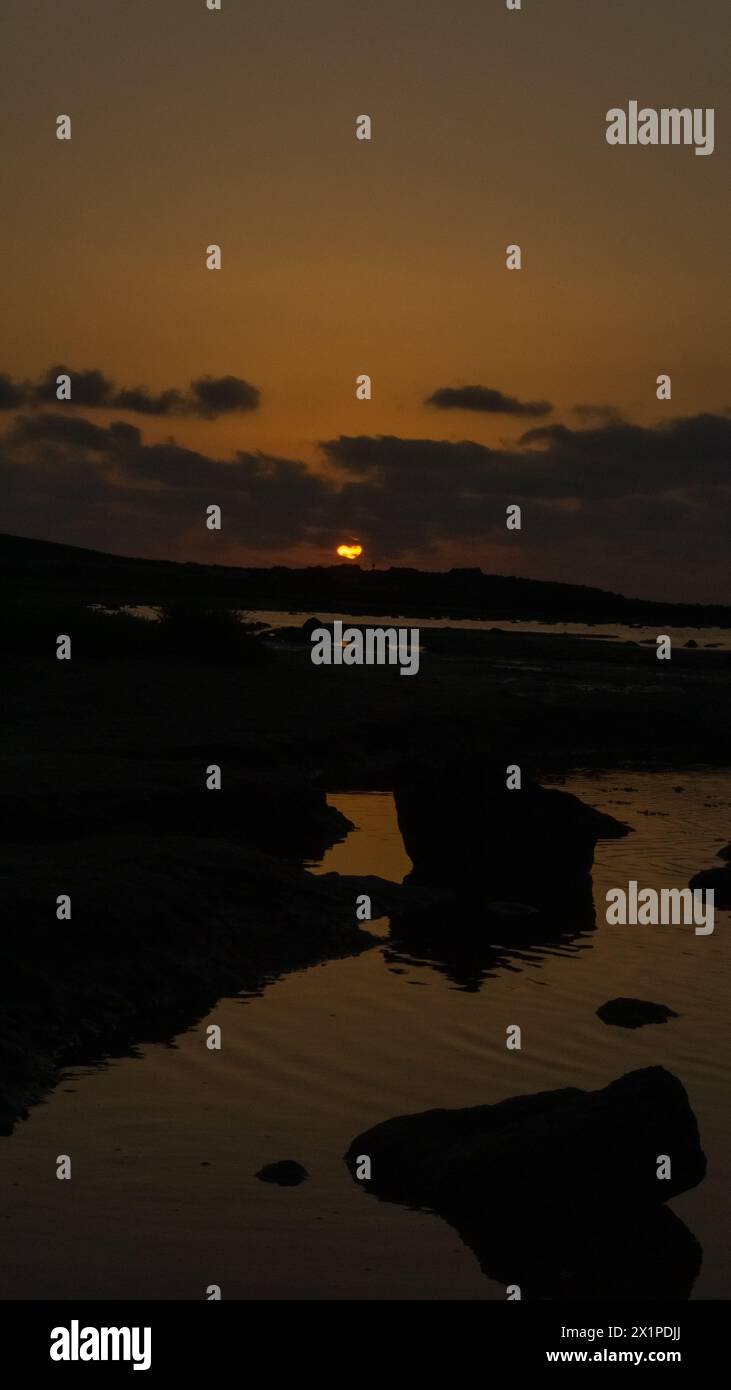 Dramatic dusk, tranquil beach scene Stock Photo - Alamy