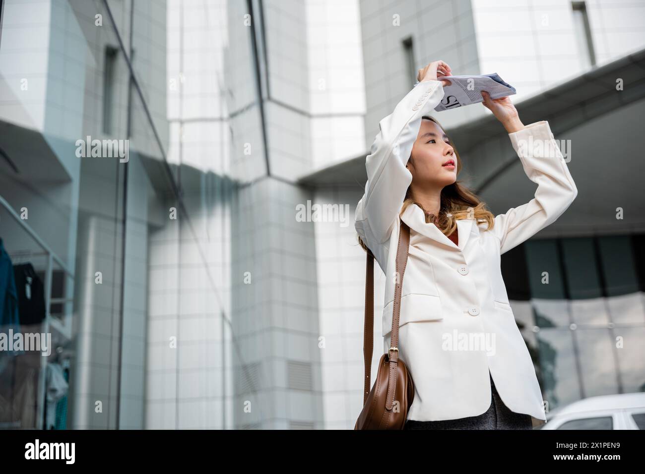 woman walking out the building after finish work shade sun UV with ...