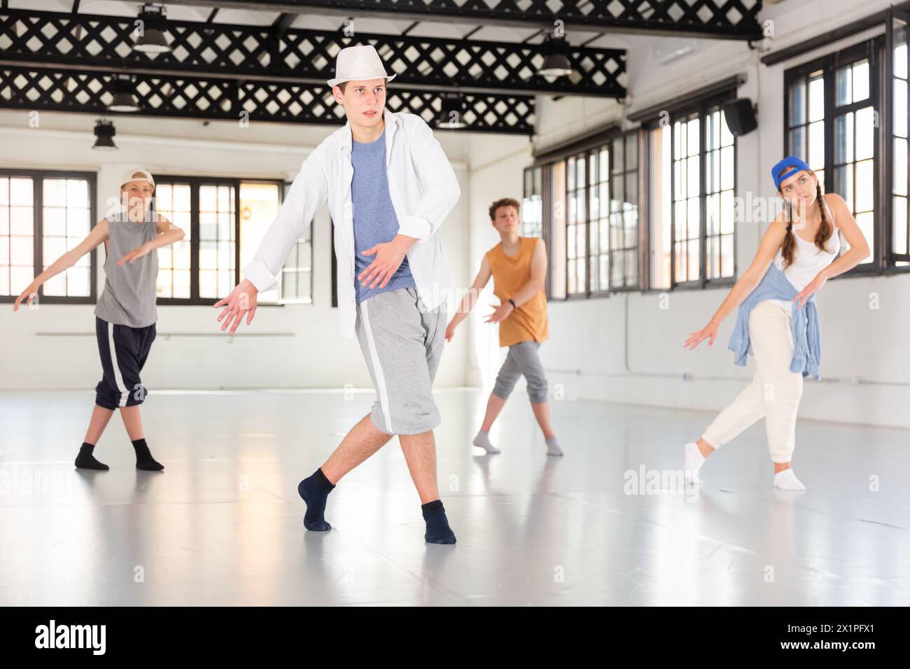 Teenage dancers practicing active dance at studio Stock Photo - Alamy