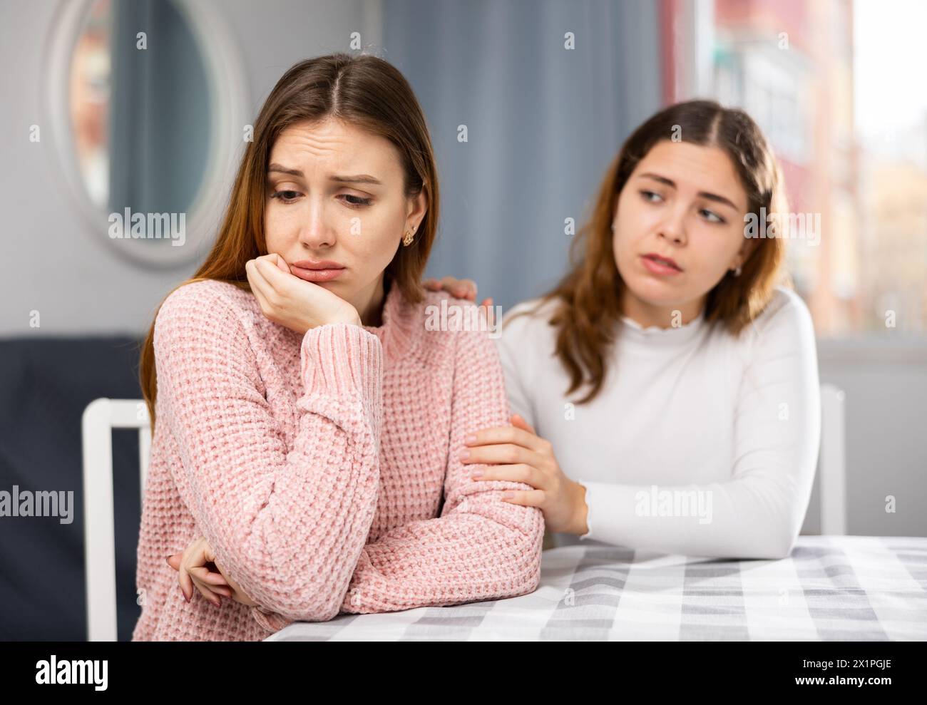 Woman comforting her friend after domestic quarrel Stock Photo - Alamy