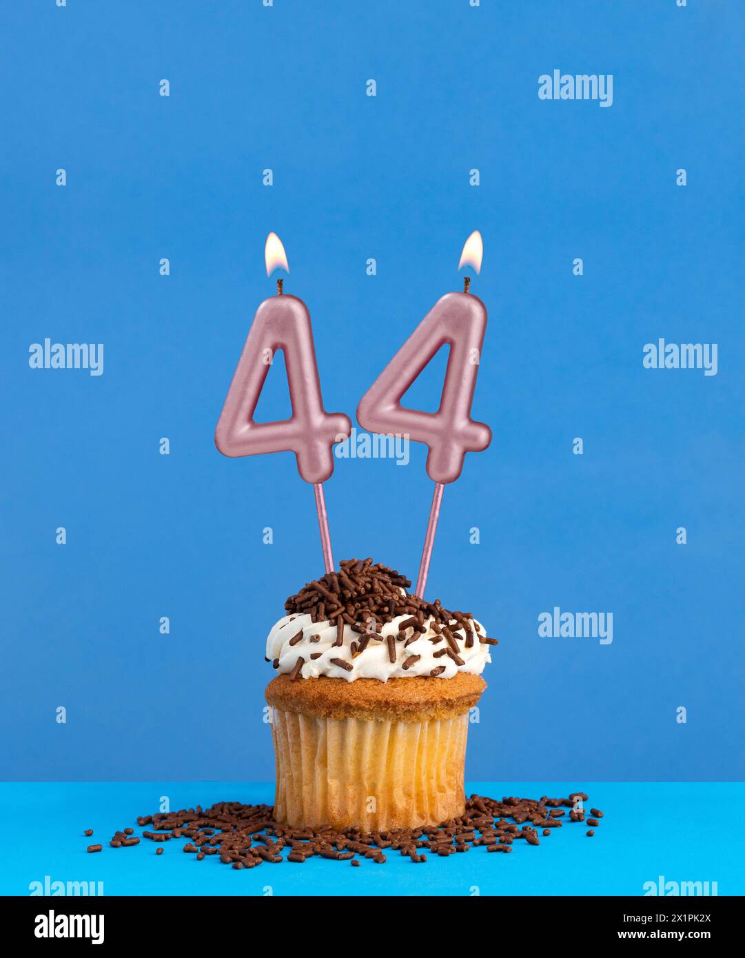 Candle number 44 - Birthday card with cupcake on blue background Stock ...