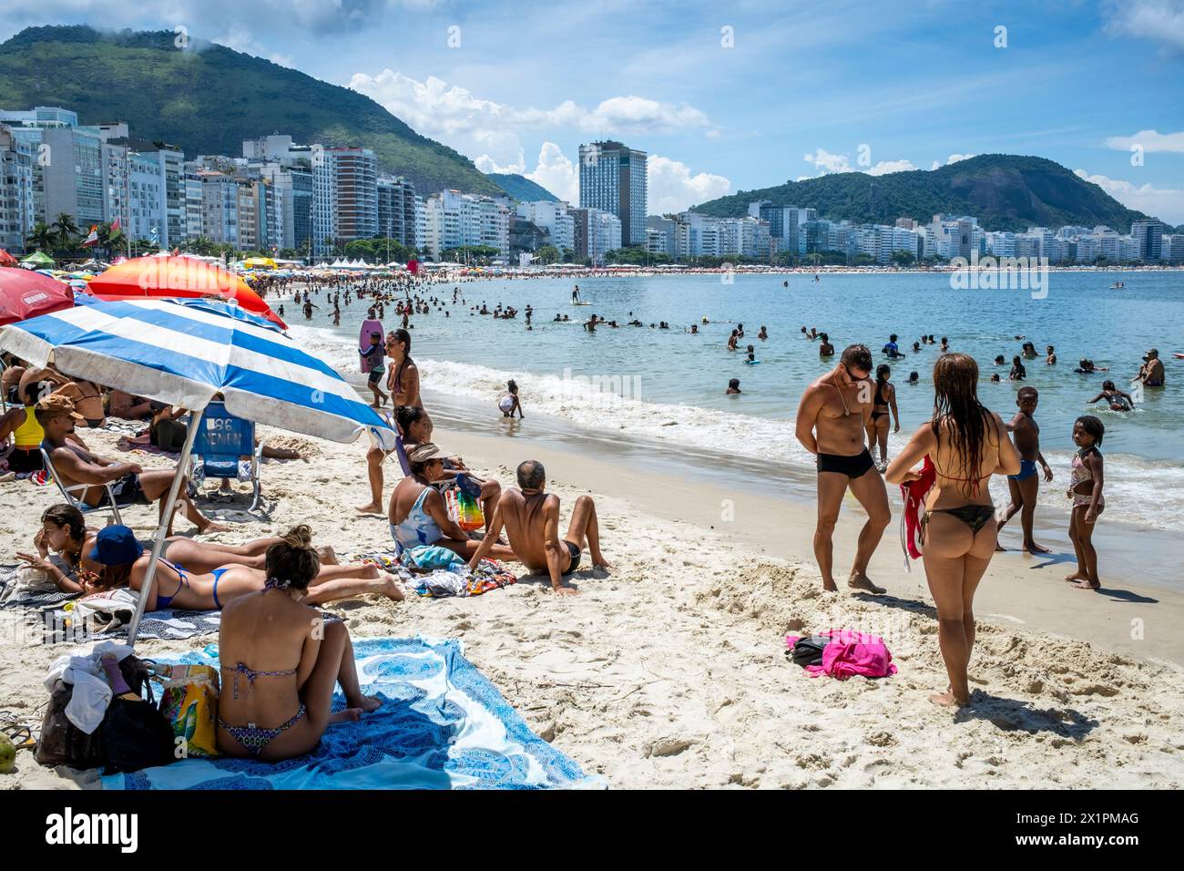 Local People Enjoying The Sunshine On Copacabana Beach Rio De Janeiro