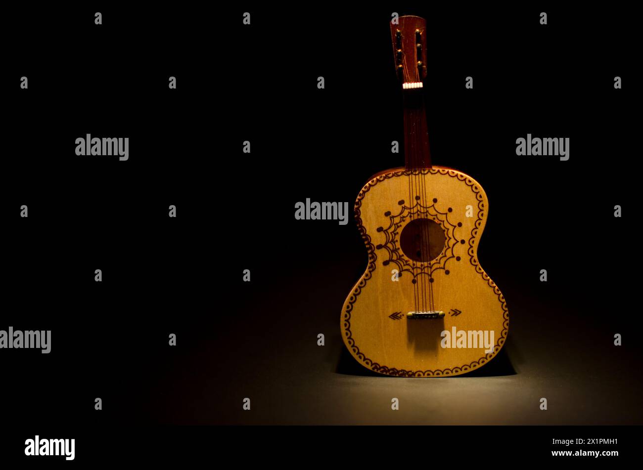 A miniature representation of a mexican "Guitarron" , an acoustic bass ...