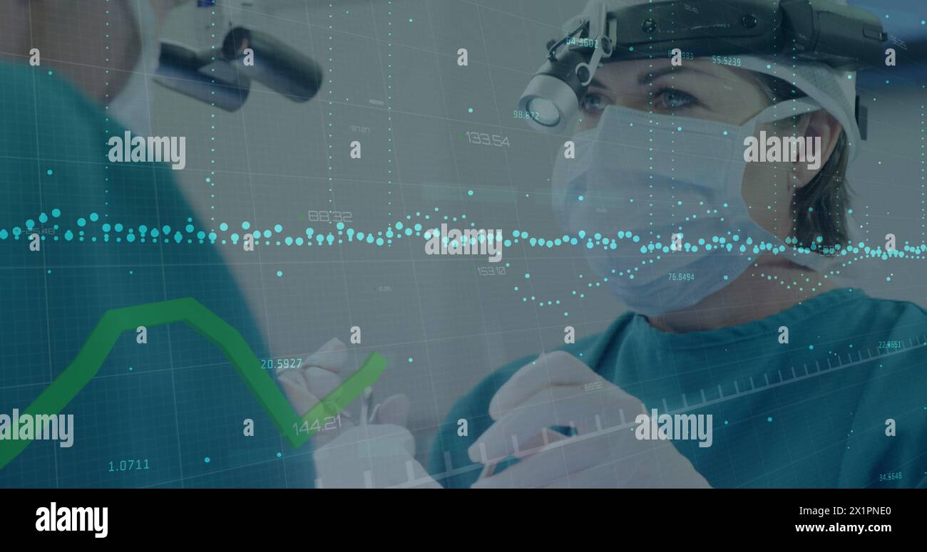 Caucasian female doctor wearing surgical gear is performing surgery ...