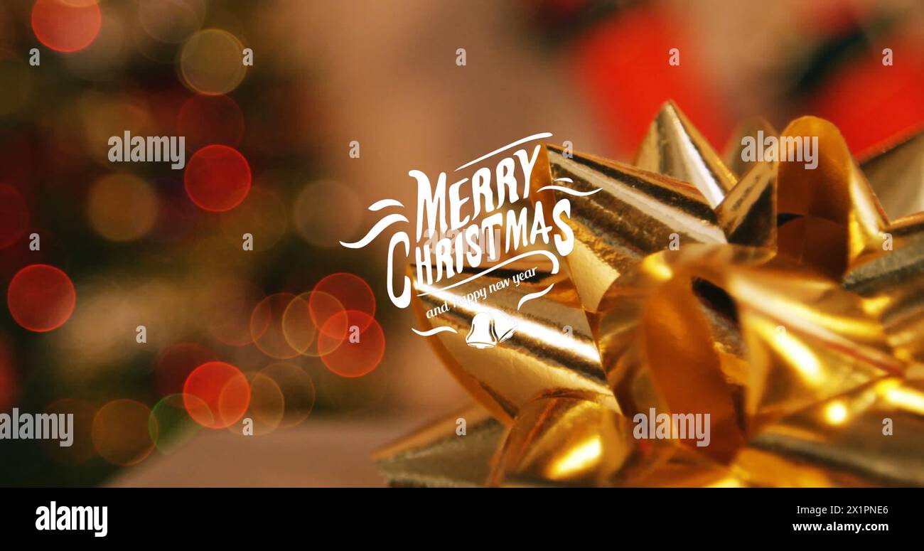 Golden ribbon adorning gift, with Merry Christmas text in focus Stock ...