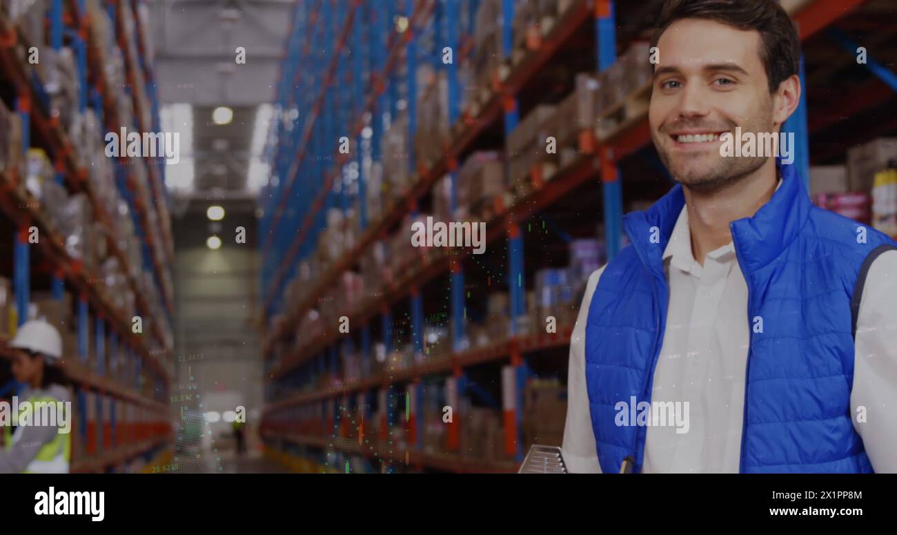 Caucasian male coworker wearing blue vest standing in a warehouse Stock ...