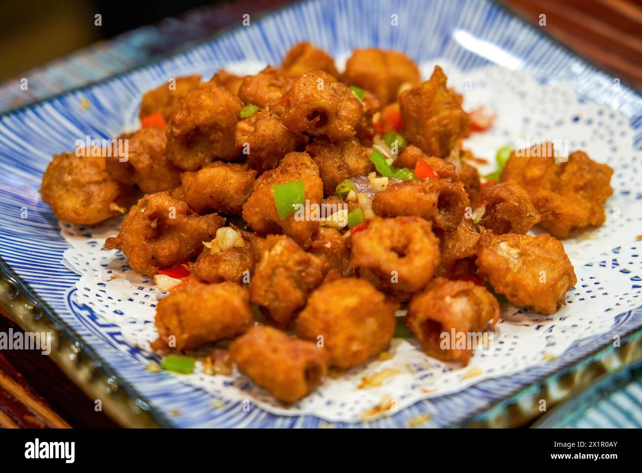 A plate of delicious Chinese food, deep fried crispy pig intestines ...