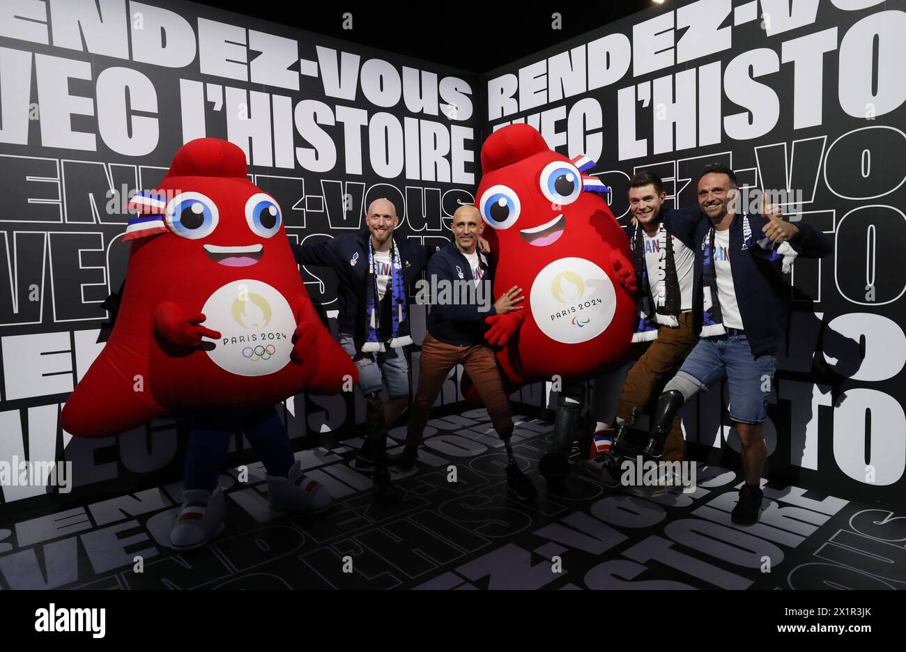 Paris, France. 17th Apr, 2024. People pose with the Paris Olympic and ...