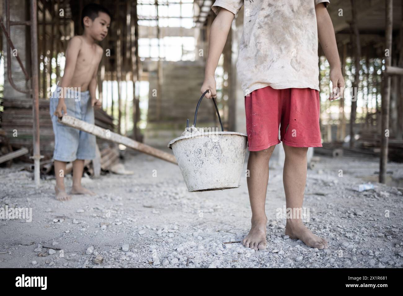 Poor children at the construction site were forced to work. Concept ...