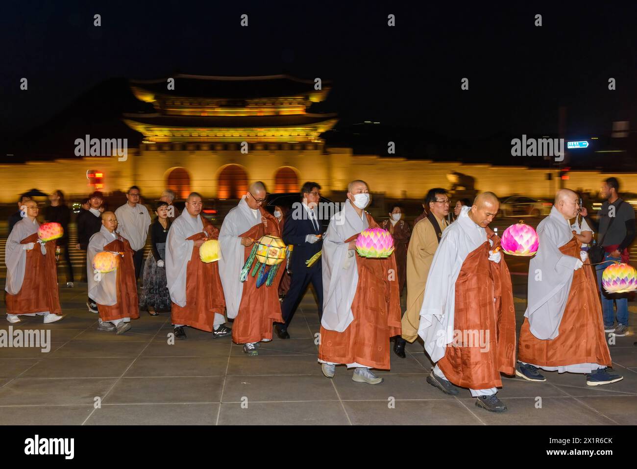South Korean Buddhist monks circling the pagoda during a lighting ...