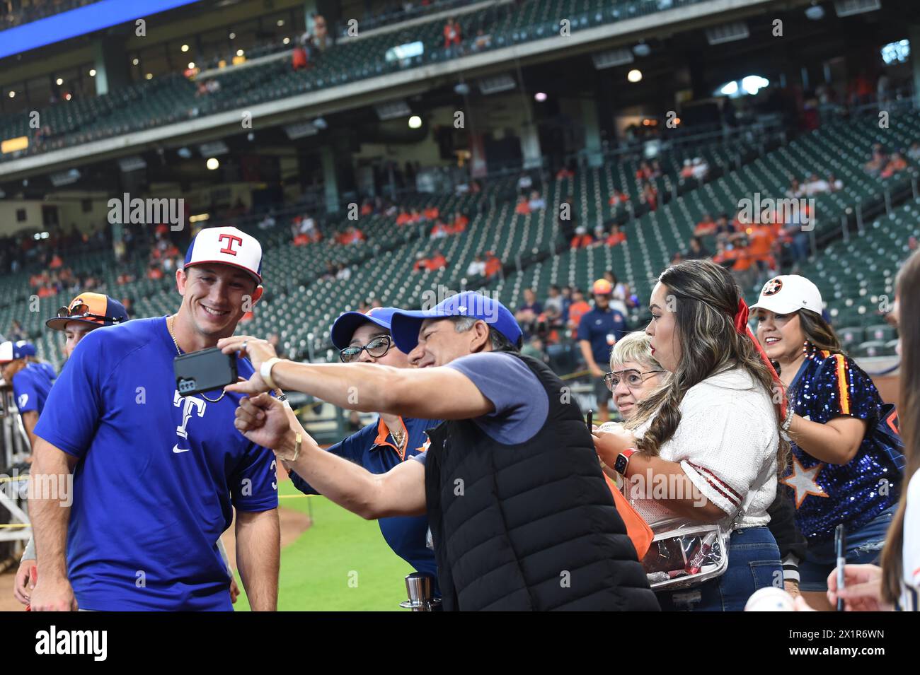 Texas Rangers outfielder Wyatt Langford (36) takes selfie with fans ...