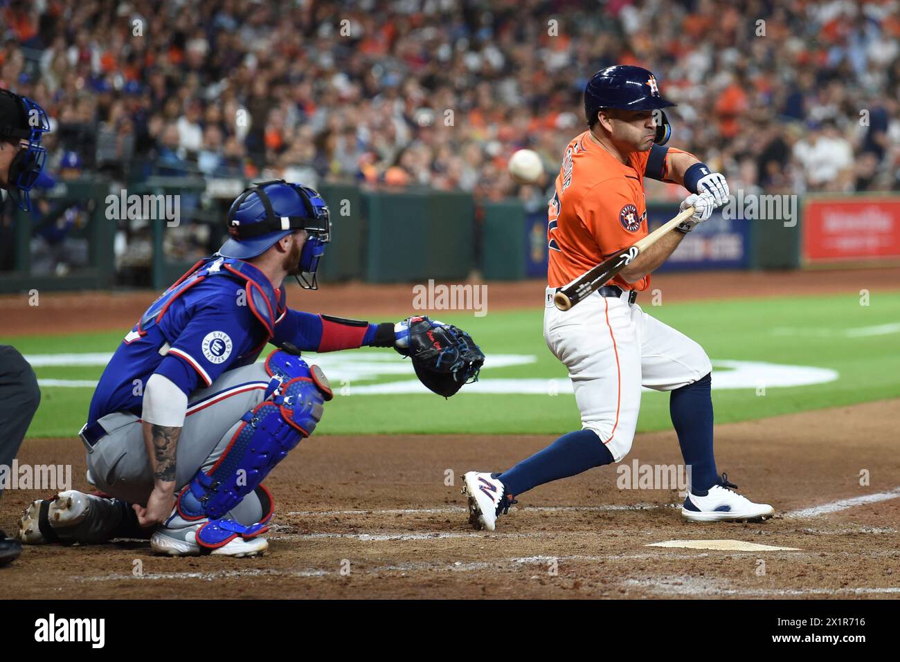 Houston Astros second base Jose Altuve (27) hits a foul ball during the MLB baseball game ...