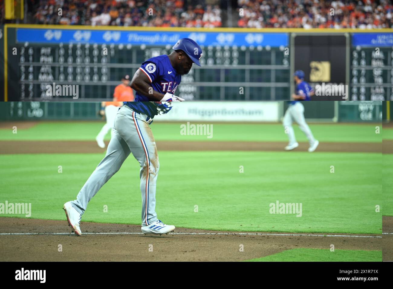 Texas Rangers outfielder Adolis Garc’a (53) walks and moves Texas ...