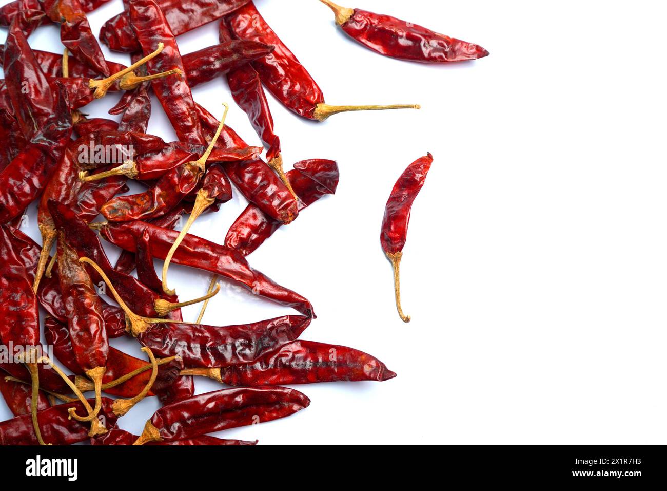 Dry chilli on white background Stock Photo - Alamy