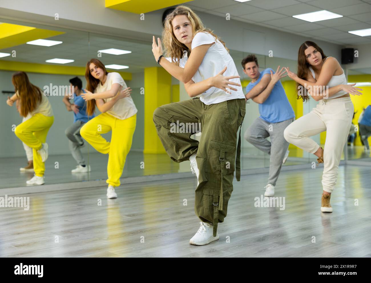 Teenage girl training breakdance Footwork moves in dance hall Stock ...