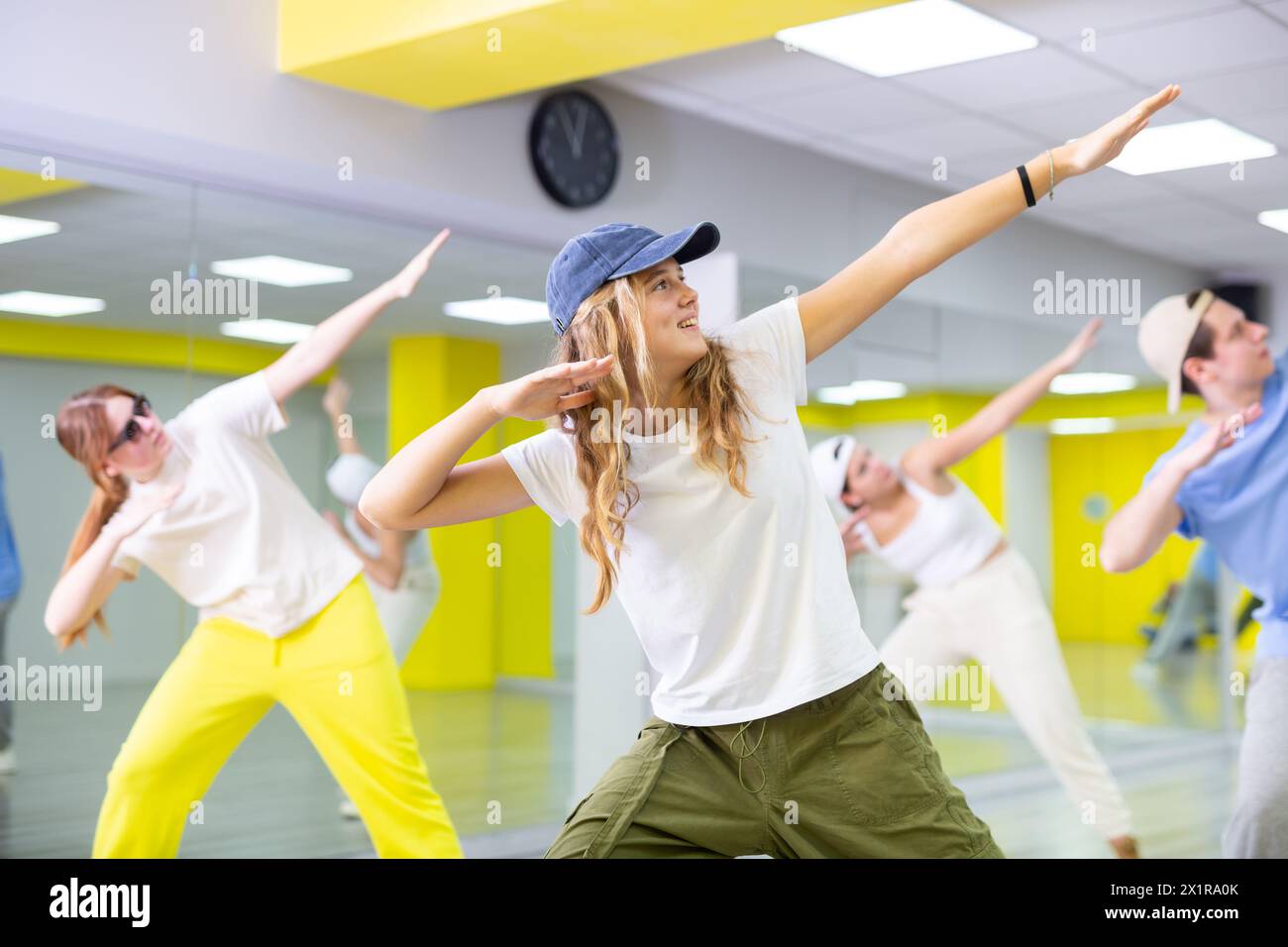 Group of cheerful, talented and active tween dancers forming straight ...
