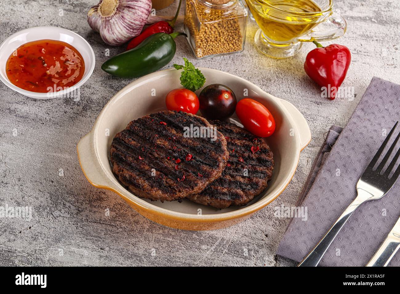Grilled beef burger cutlet with sauce Stock Photo - Alamy