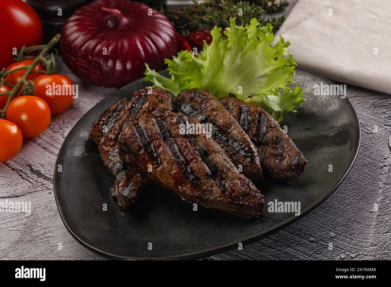 Grilled diet beef liver steak in the plate Stock Photo - Alamy