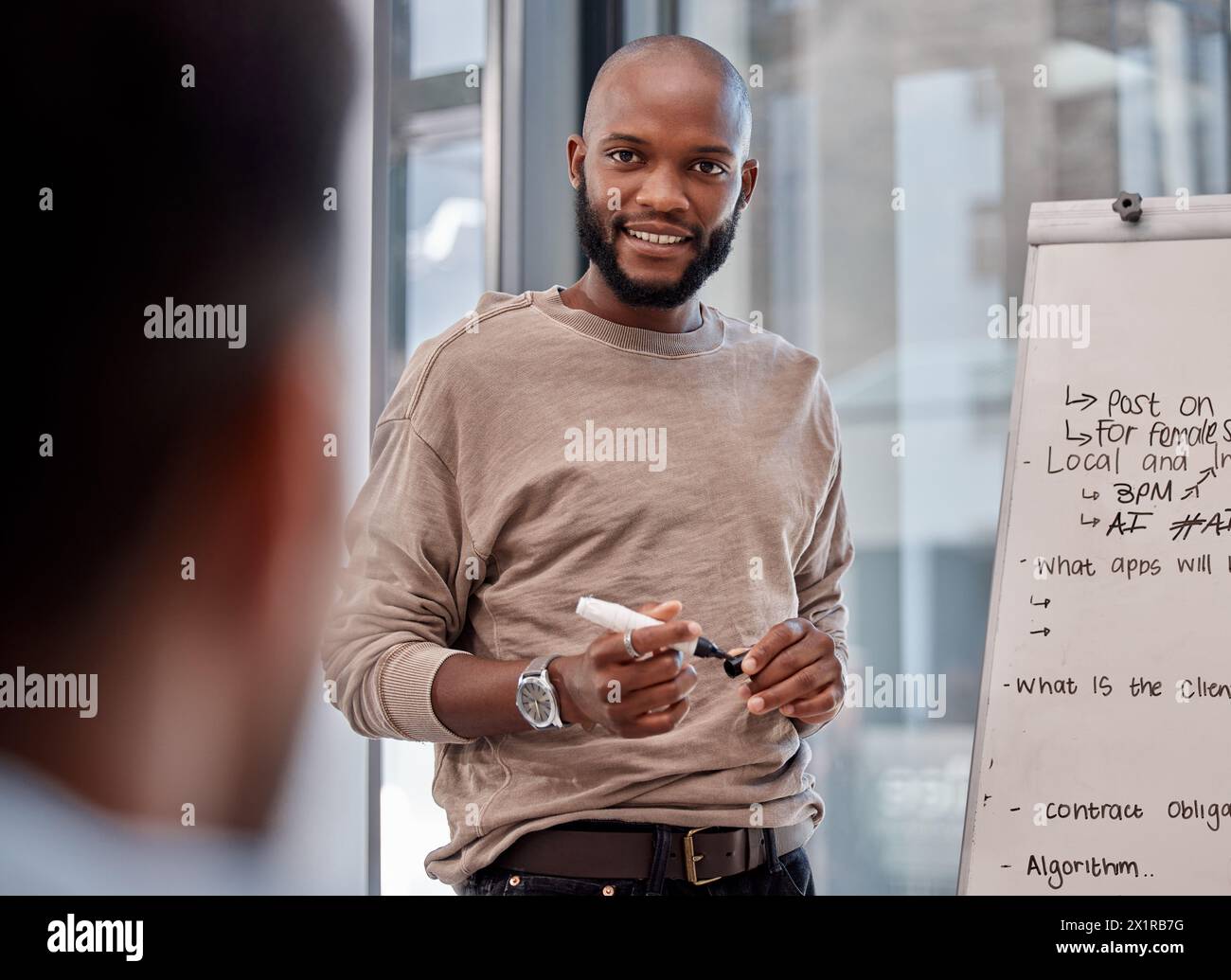 Black man, coach and meeting with Flipchart for presentation, teaching ...