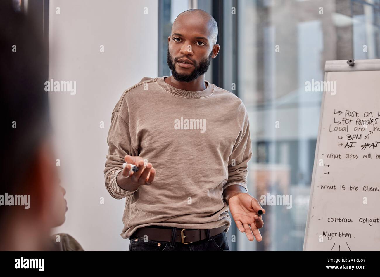 Black man, coach and meeting with flipchart for teaching, presentation ...