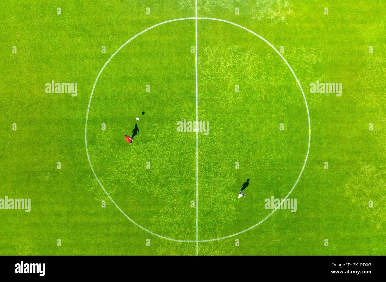 football in the middle of the football field Stock Photo - Alamy